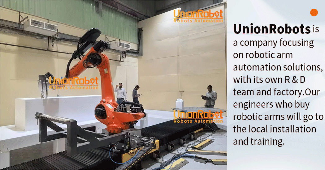 Engineers training customers in the Middle East use robotic arm